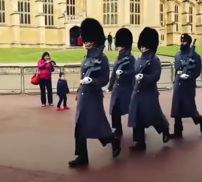 Guardsmen At Windsor Castle Break Formation For Young Boy