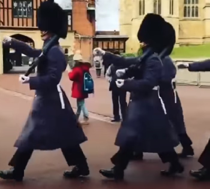 Guardsmen At Windsor Castle Break Formation For Young Boy