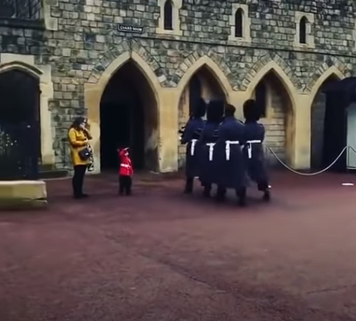 Guardsmen At Windsor Castle Break Formation For Young Boy