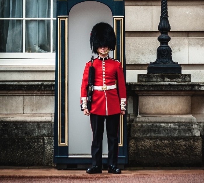 Guardsmen At Windsor Castle Break Formation For Young Boy