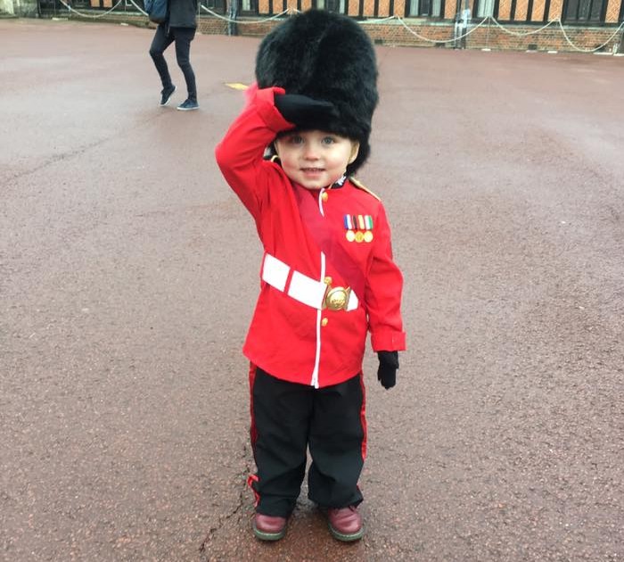 Guardsmen At Windsor Castle Break Formation For Young Boy