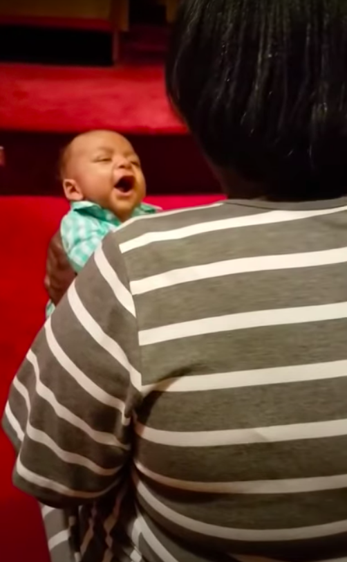 Baby at church sings hymns with passion
