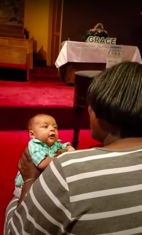 Baby at church sings hymns with passion