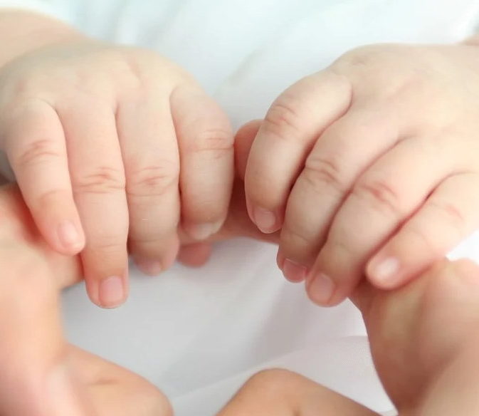 Twin Baby Girls Share an Adorable Heart to Heart