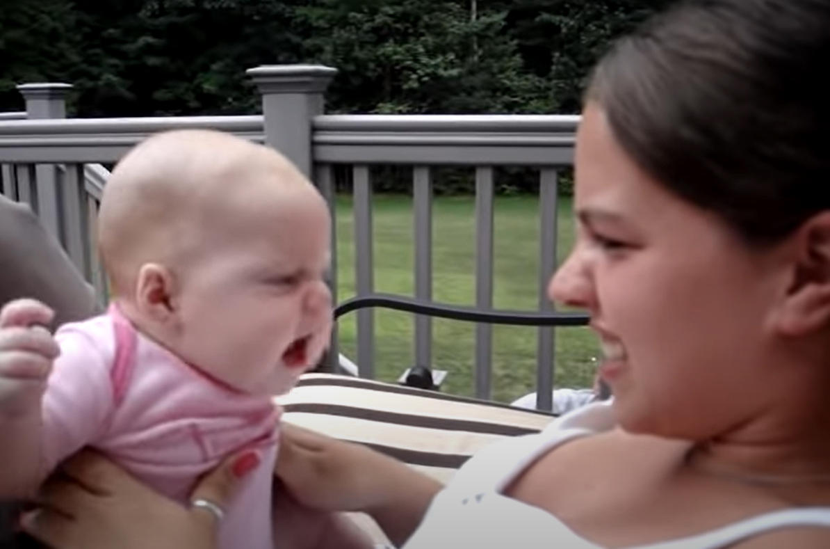 Funny baby girl growls at auntie