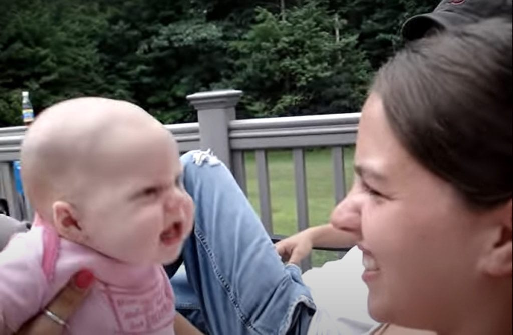 Funny baby girl growls at auntie