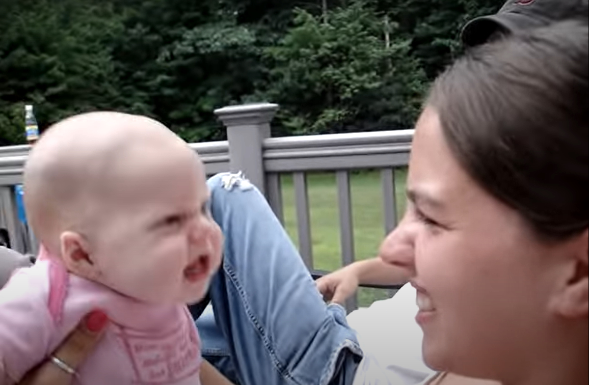 Funny baby girl growls at auntie