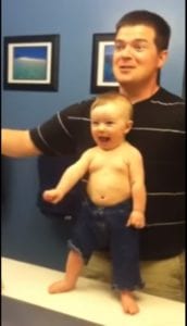 Baby and dad have adorable muscle flexing contest in the mirror