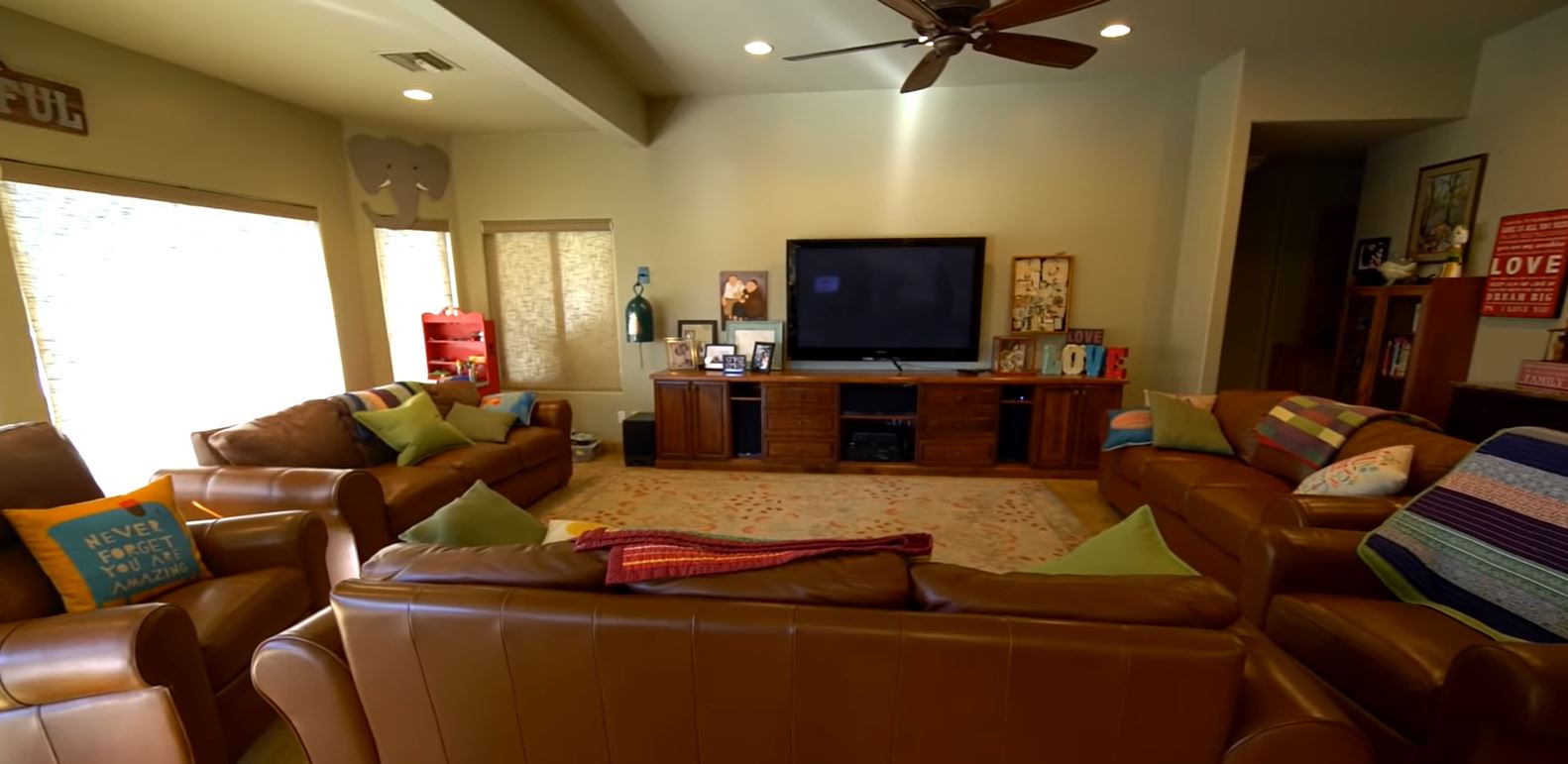 14 Adopted kids build new family room for humble mom and dad