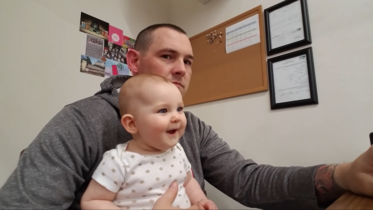 Dad plays Elmo for baby girl capturing priceless reaction gone viral