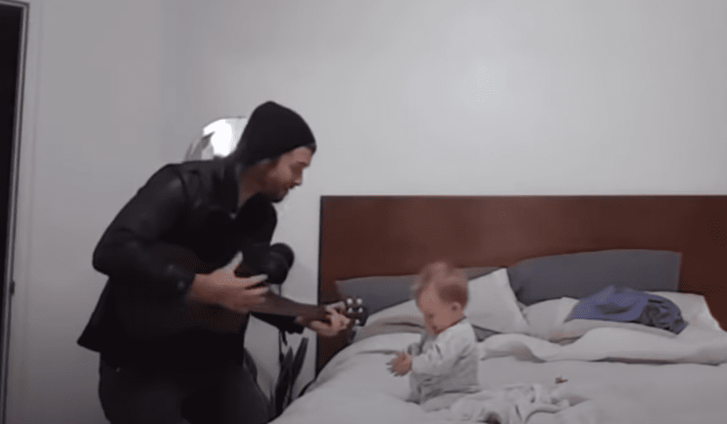 Dad starts strumming and baby has most precious reaction