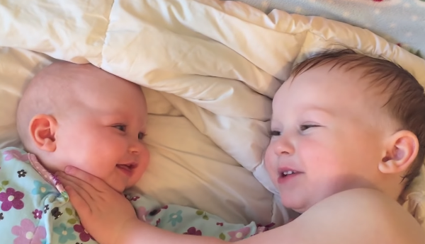 Older brother has cutest way to calm his crying baby sister