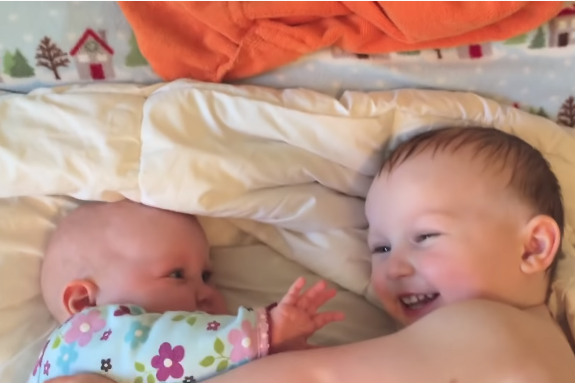 Older brother has cutest way to calm his crying baby sister