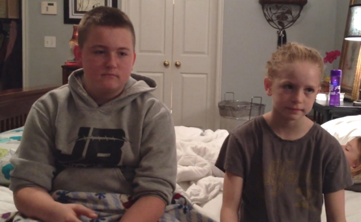 Kids are in middle of singing for camera unaware little brother ...