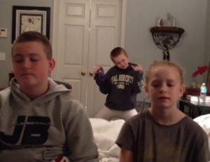 Kids are in middle of singing for camera unaware little brother ...