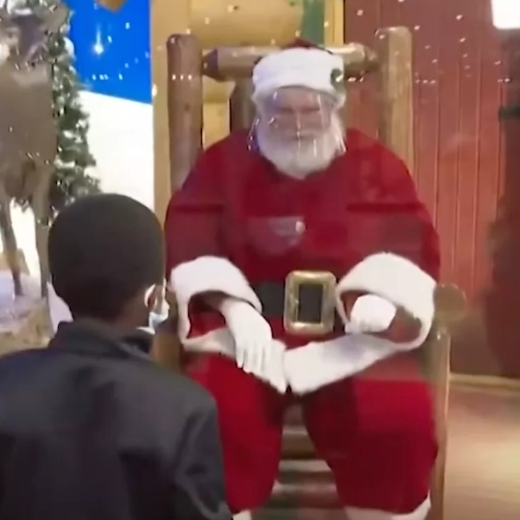 Santa and blind, autistic child having a soulful moment