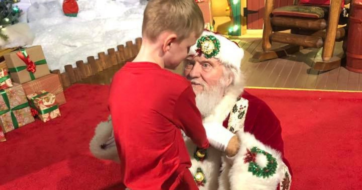 Santa and blind, autistic child having a soulful moment