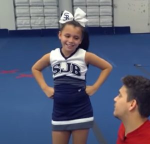 Teen comes to cheerleader’s rescue when her dad can’t be there on ...