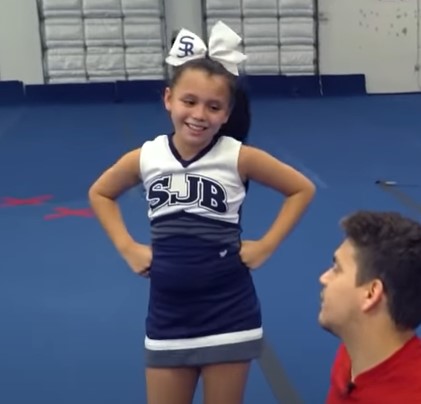Teen comes to cheerleader’s rescue when her dad can’t be there on ...