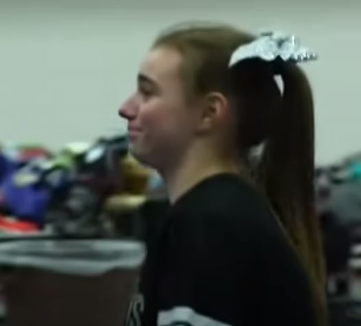 Cheerleader can’t stay on her feet when Navy dad walks out from behind ...