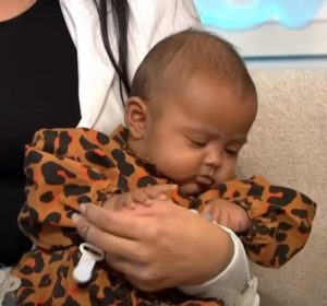 Mom gives birth to twins then notices one baby starts turning darker